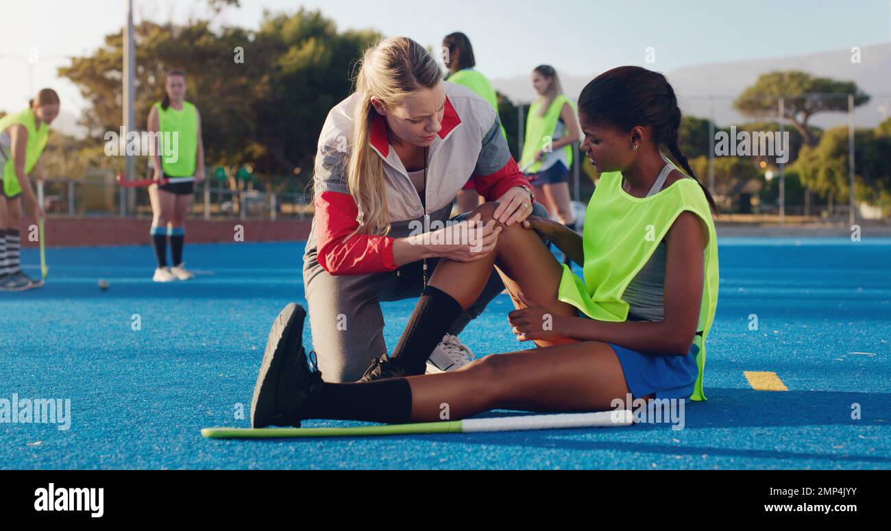 Woman, sports and knee injury in hockey training, practice or game on a ...