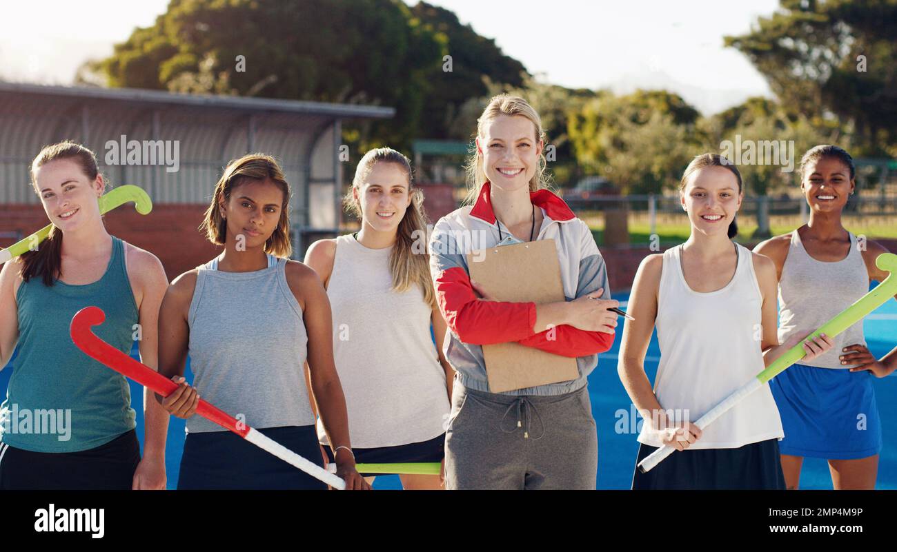 Portrait, hockey and a sports coach with her team standing outdoor ...