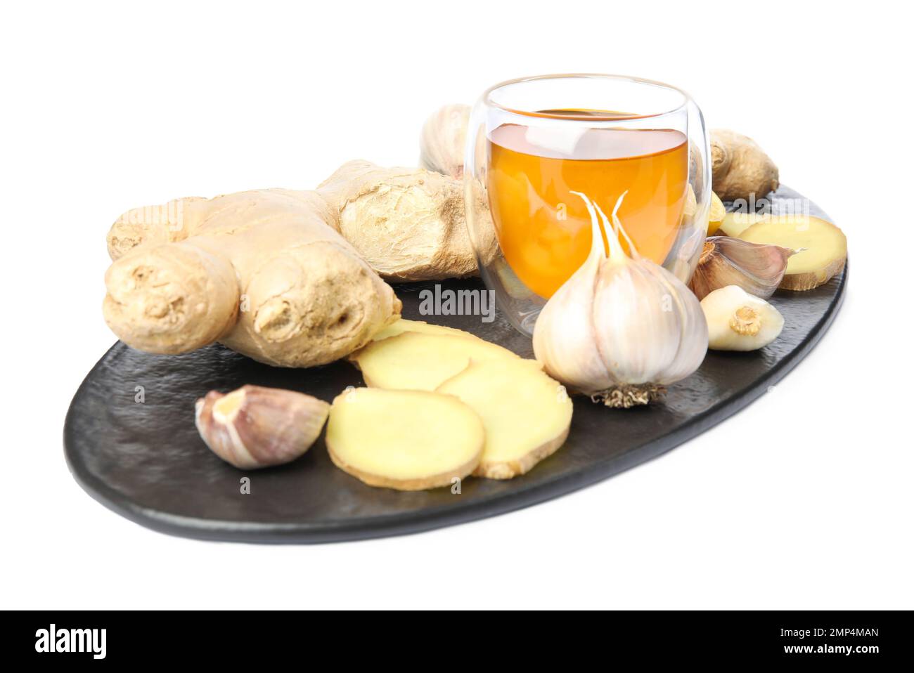 Fresh garlic and other natural cold remedies isolated on white Stock ...
