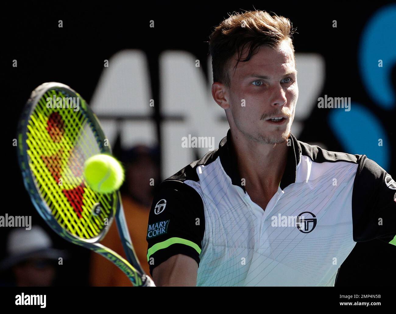 Hungary's Marton Fucsovics makes a forehand return to Switzerland's ...