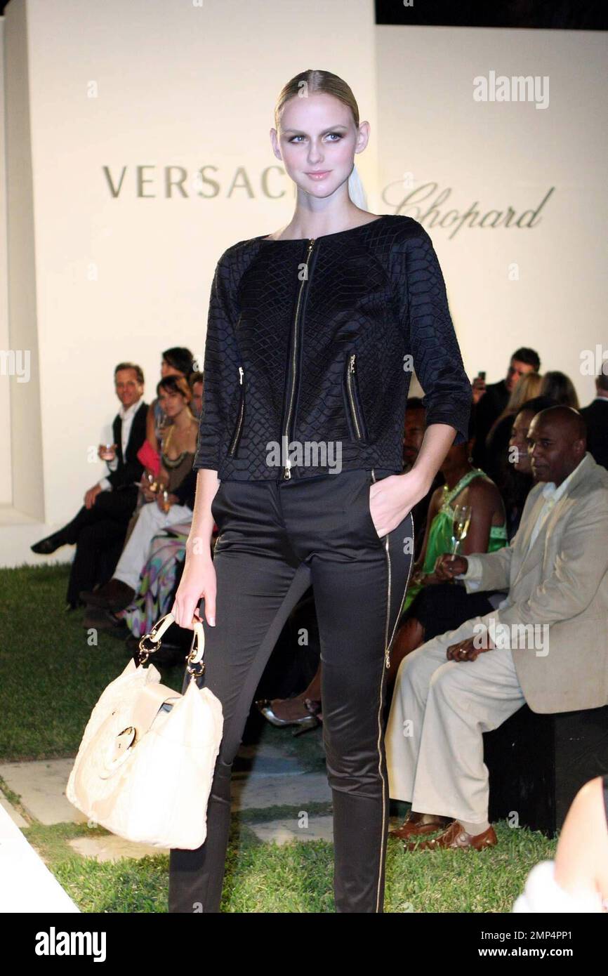 Models walk the runway during the Versace and Chopard Fashion Show at ...
