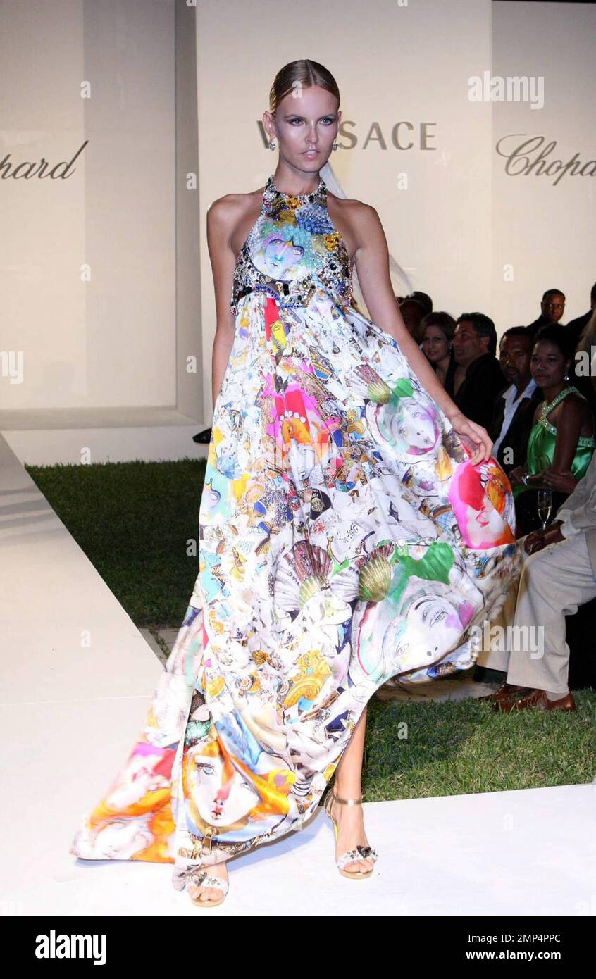 Models walk the runway during the Versace and Chopard Fashion Show at ...