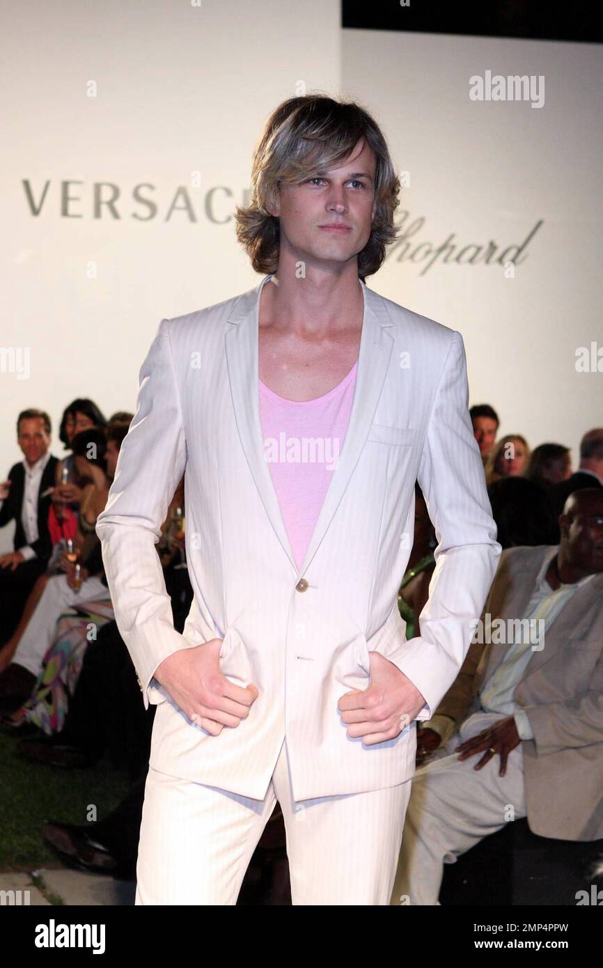 Models walk the runway during the Versace and Chopard Fashion Show at ...