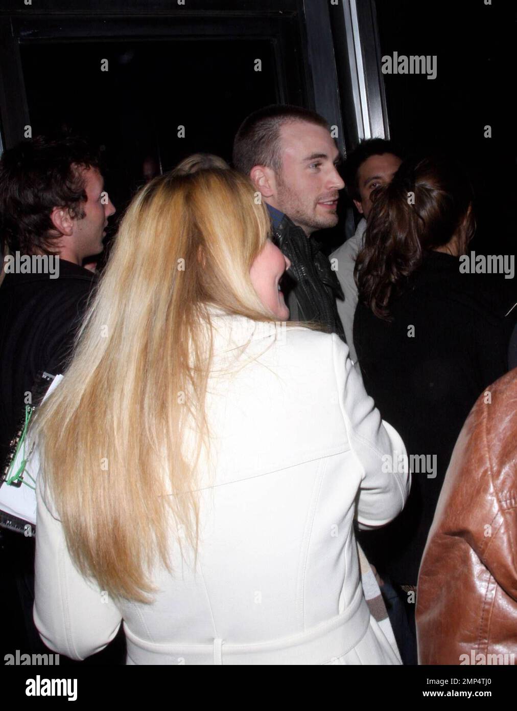 Actor Chris Evans hugs a friend as he arrives at the nightclub Ecco ...