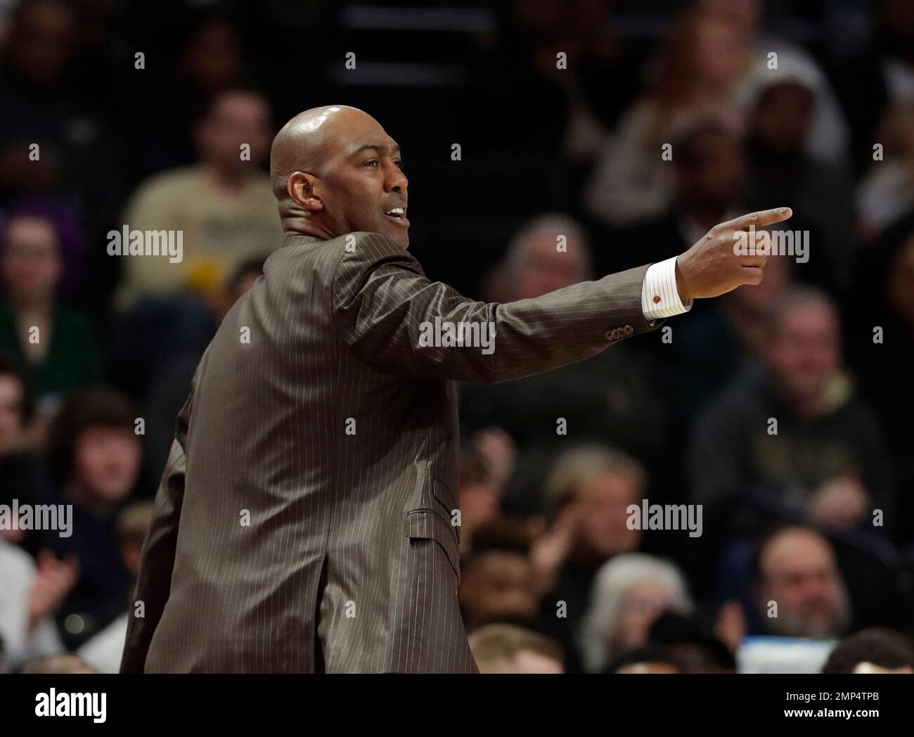 Wake Forest head coach Danny Manning directs his team against Virginia ...