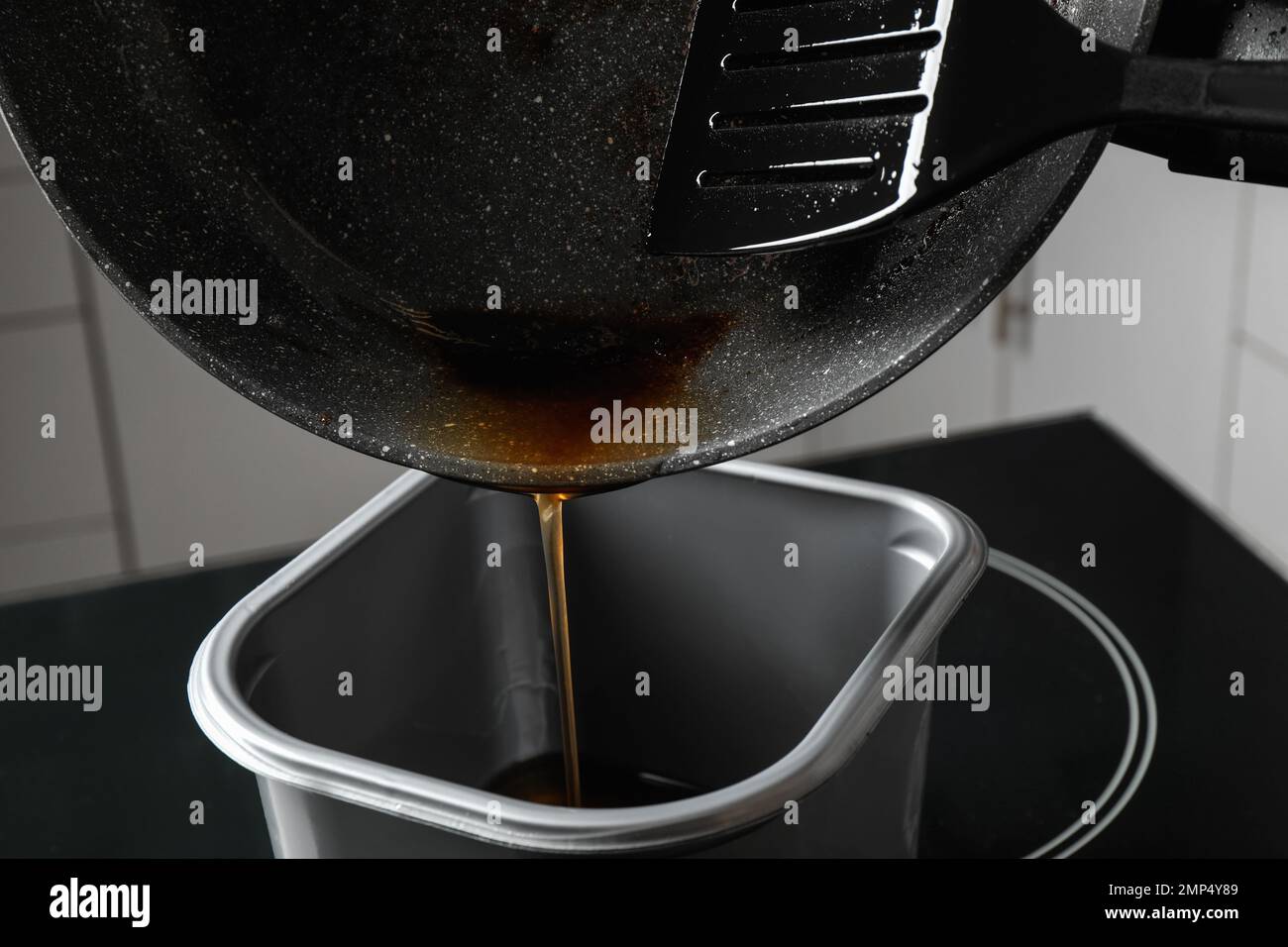Pouring used cooking oil hi-res stock photography and images - Alamy