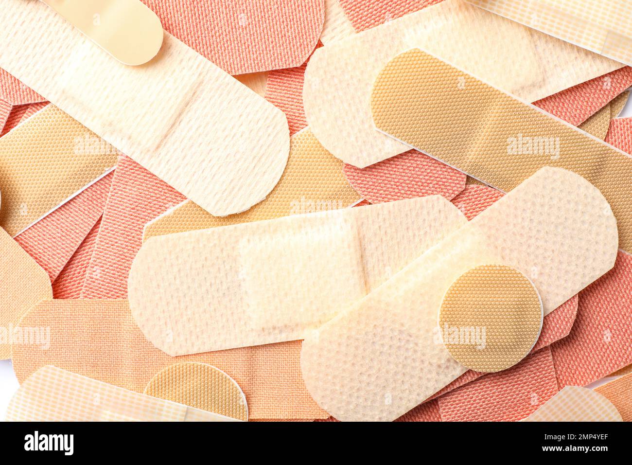 Different medical sticking plasters as background, closeup. First aid ...