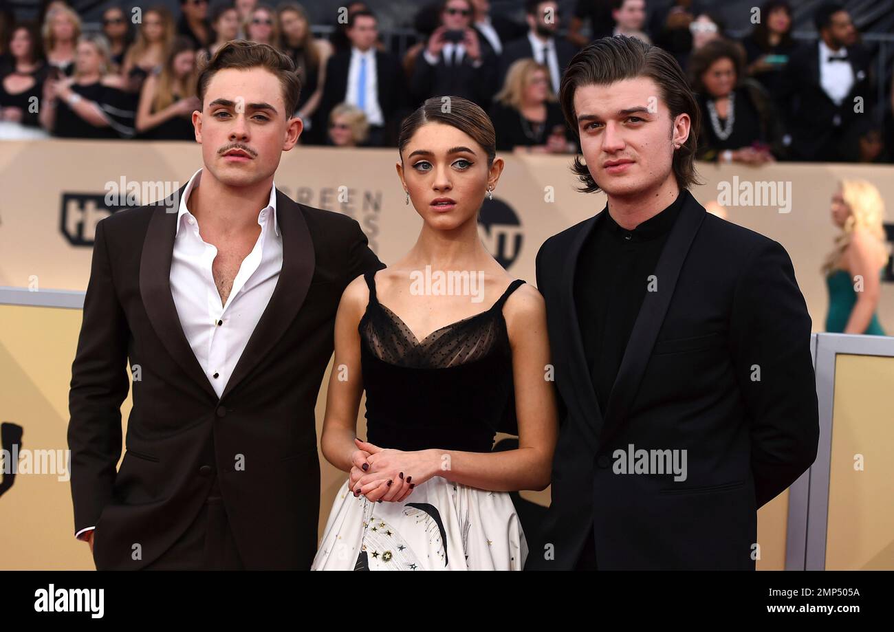 Dacre Montgomery, from left, Natalia Dyer, and Joe Keery arrive at the ...