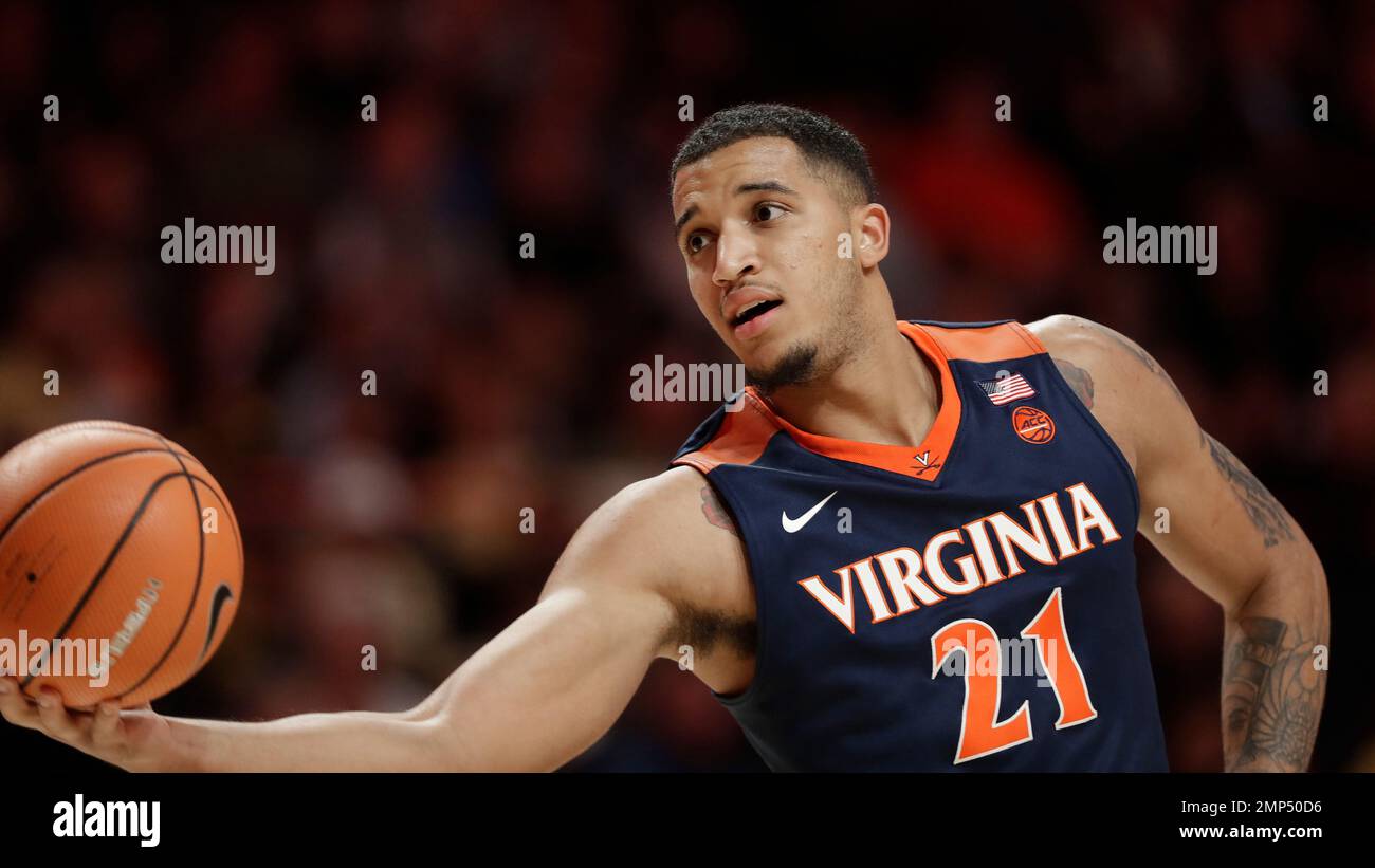 Virginia's Isaiah Wilkins (21) passes the ball against Wake Forest ...