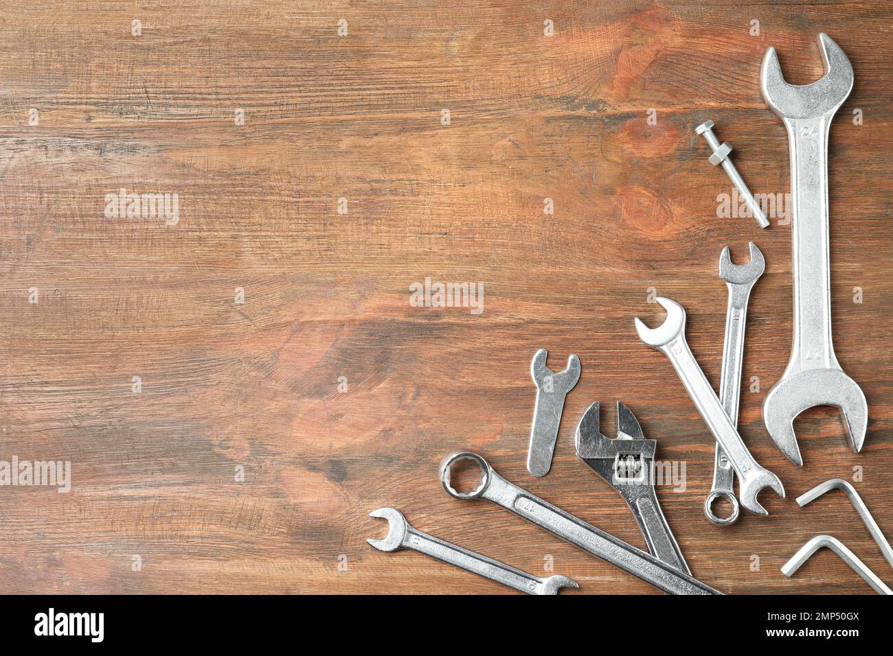 Auto mechanic's tools on wooden background, flat lay. Space for text ...
