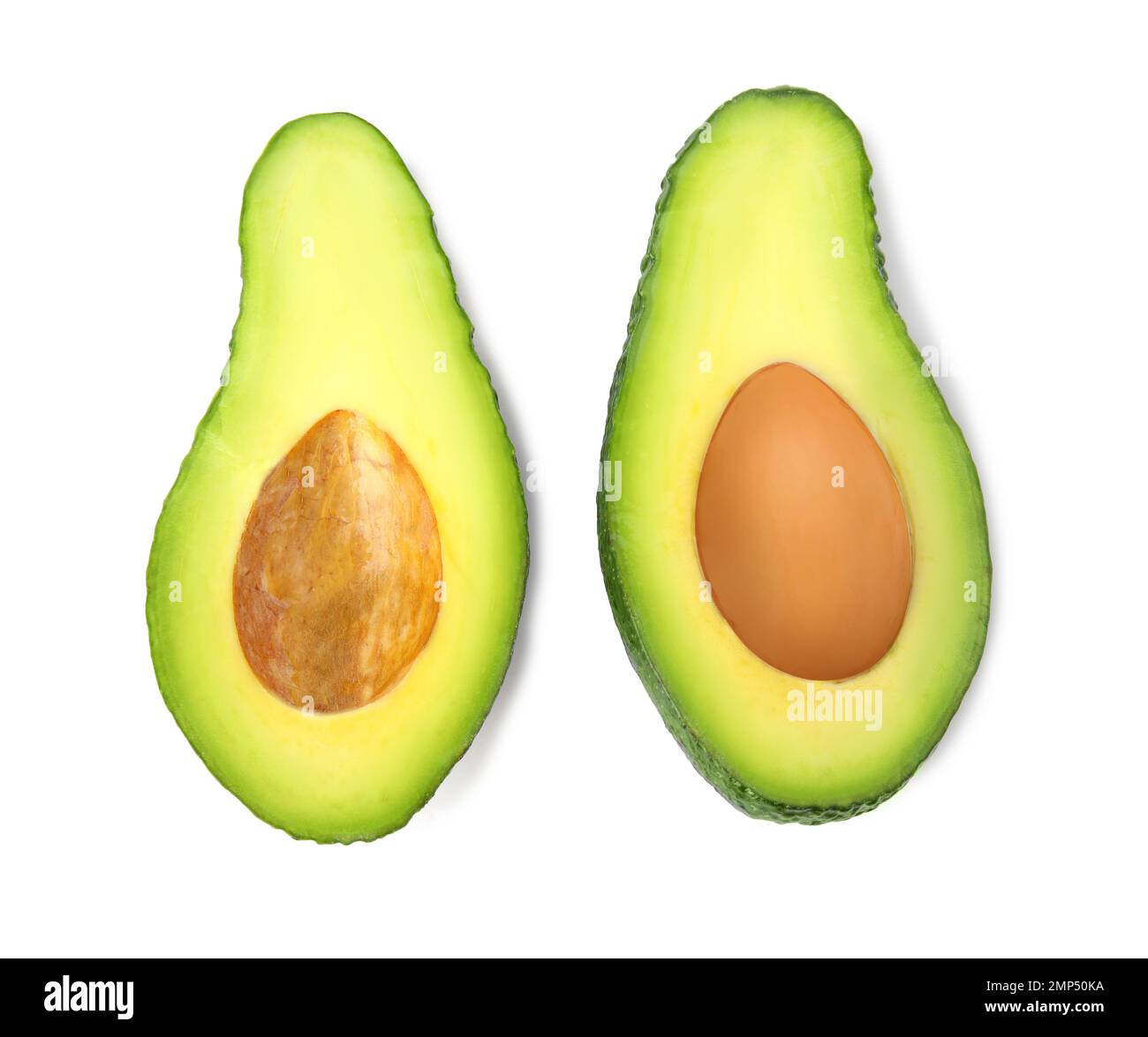 Cut tasty ripe avocados on white background, top view. Tropical fruit ...