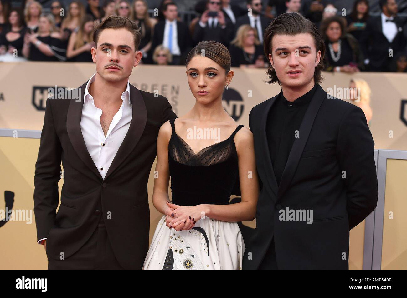 Dacre Montgomery, from left, Natalia Dyer, and Joe Keery arrive at the ...