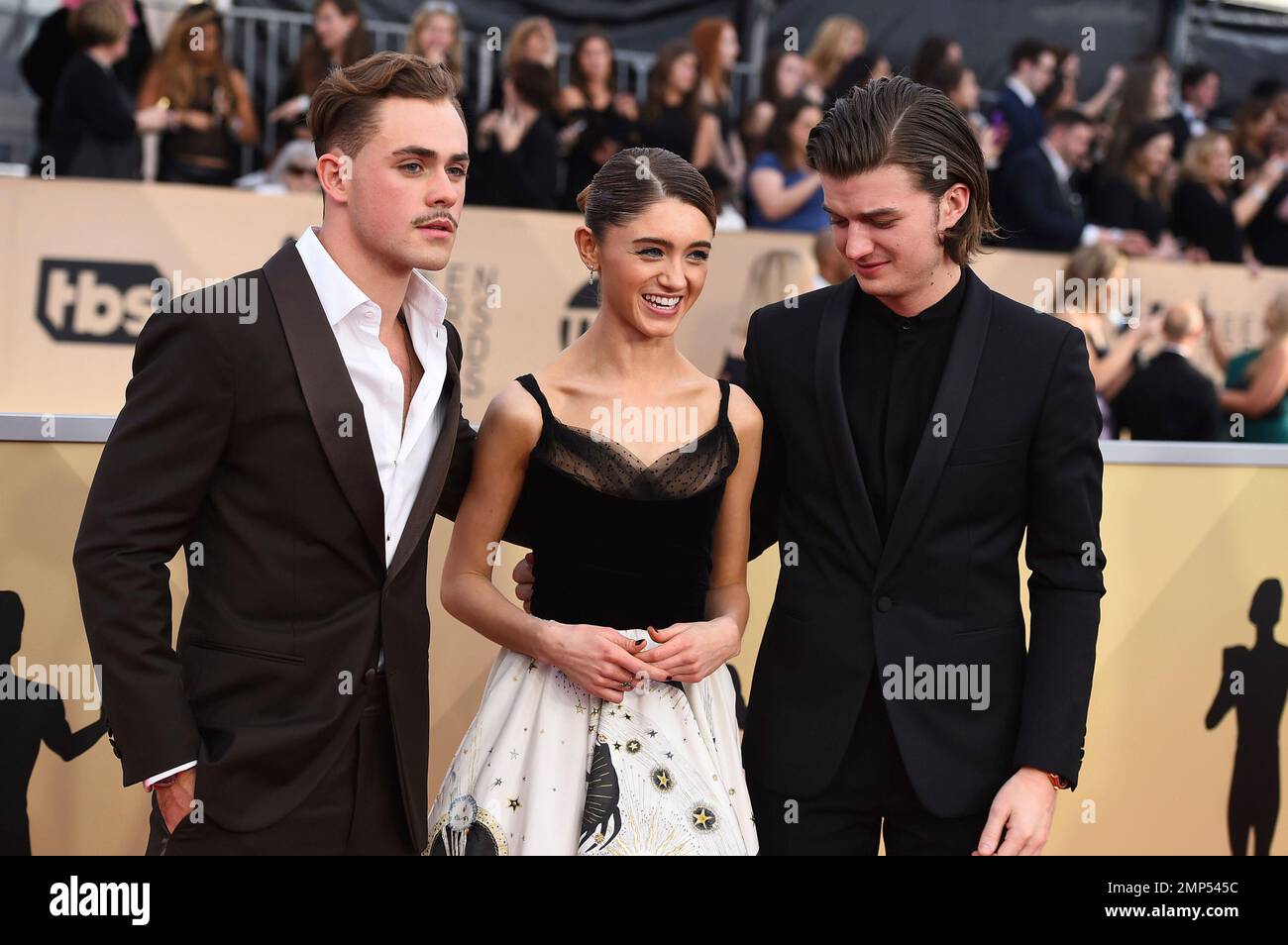 Dacre Montgomery, from left, Natalia Dyer, and Joe Keery arrive at the ...
