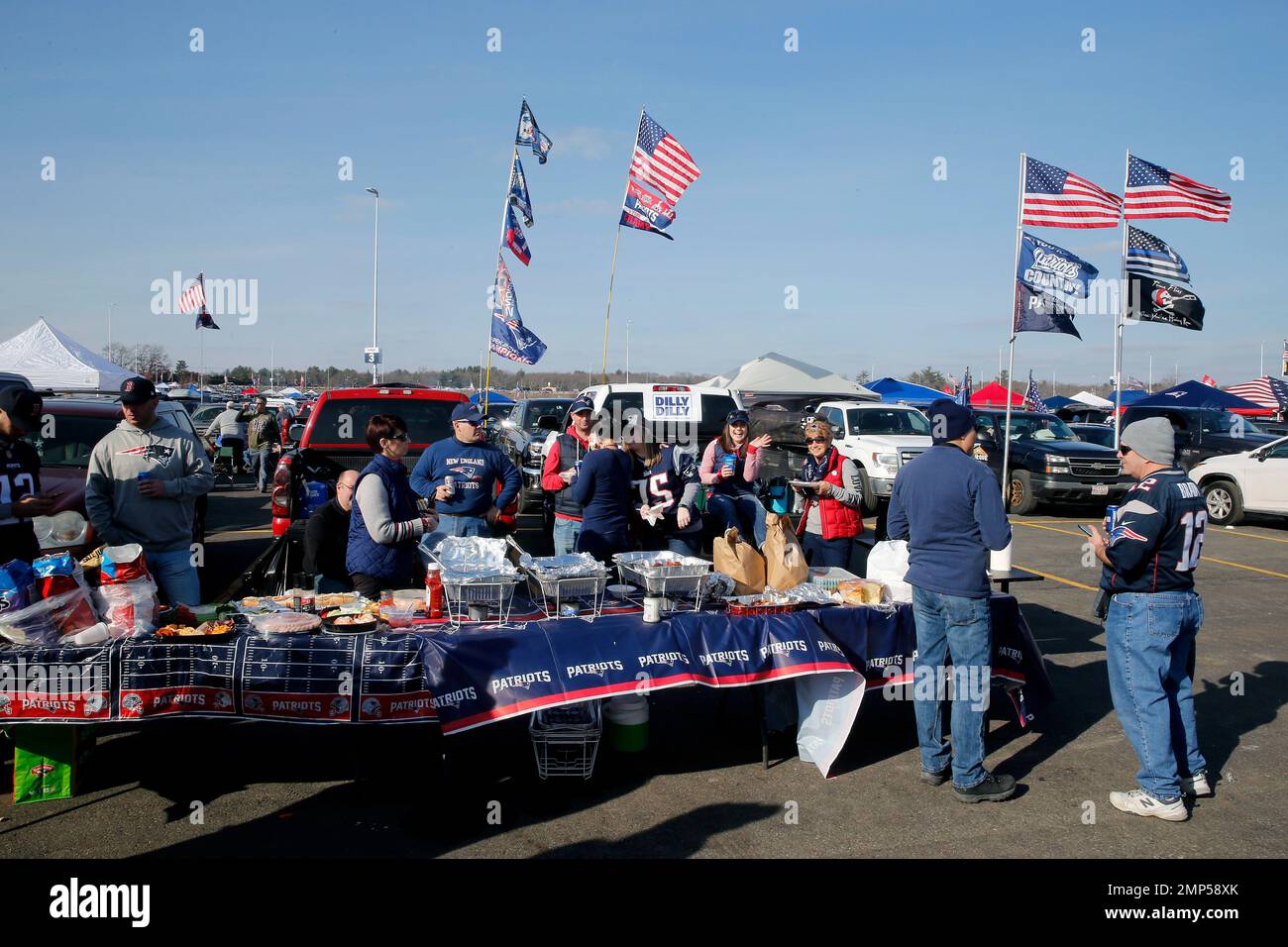 Fans tailgate in the parking lot of Gillette Stadium before the AFC ...