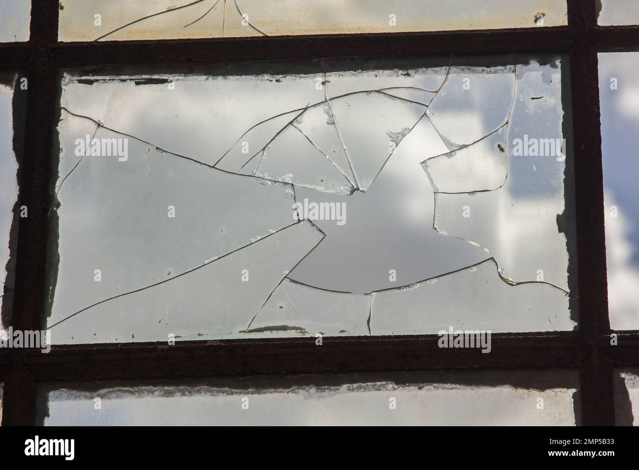 broken glass in the window. background sky, danger, devastation Stock ...