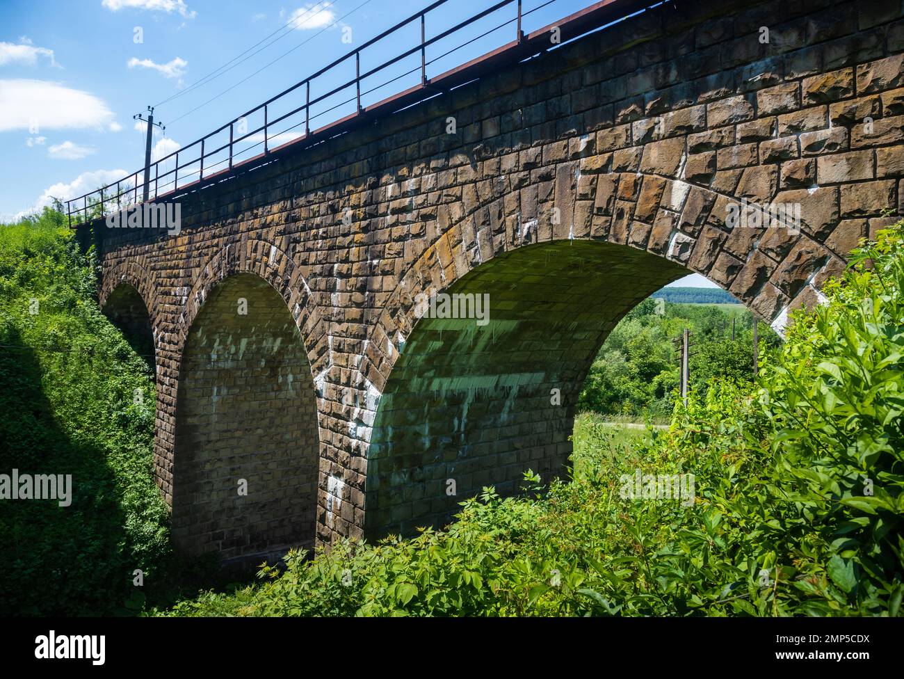 the old railway bridge is built of stone. historic building used Stock ...
