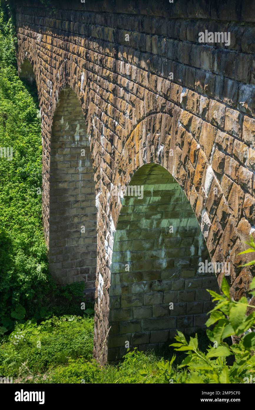 the old railway bridge is built of stone. historic building used Stock ...