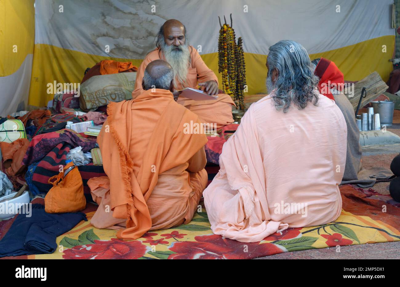 Pilgrims gathered and meditating in a tent, Allahabad Kumbh Mela, World ...