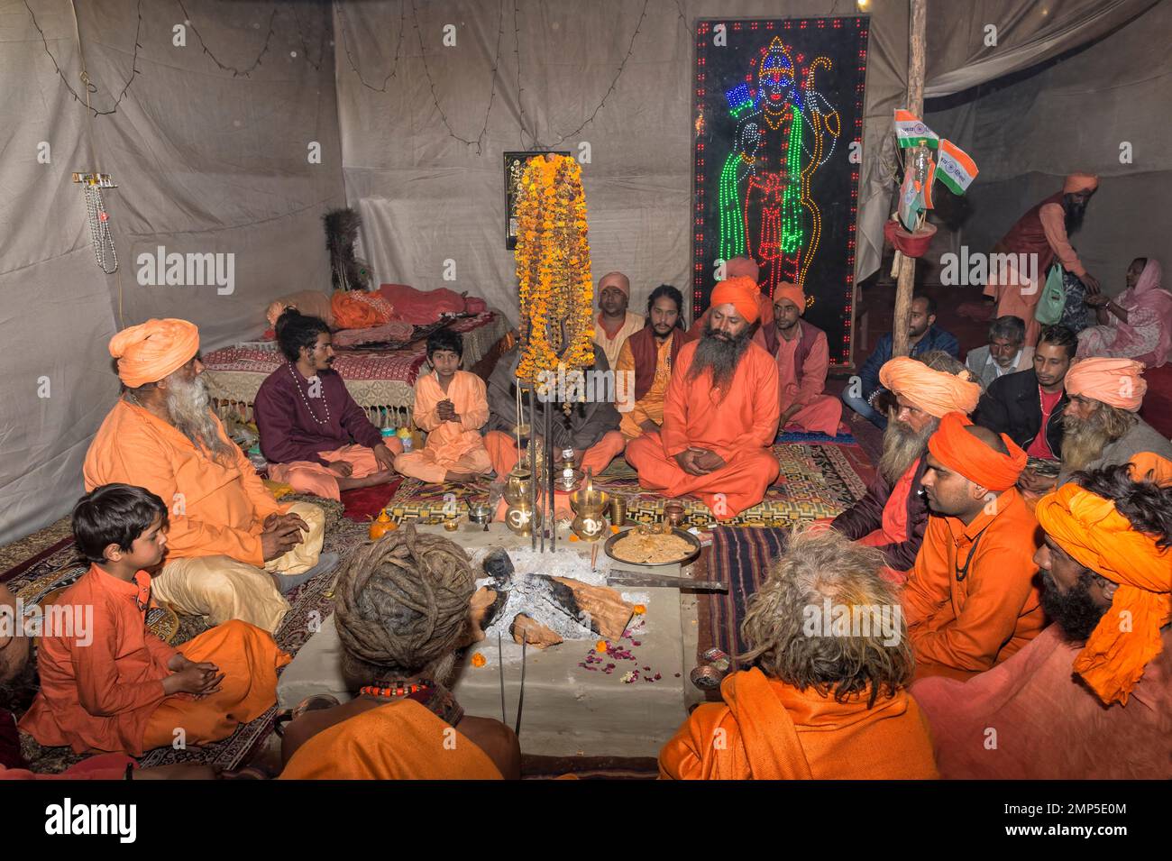 Pilgrims gathered and meditating in a tent, Allahabad Kumbh Mela, World ...