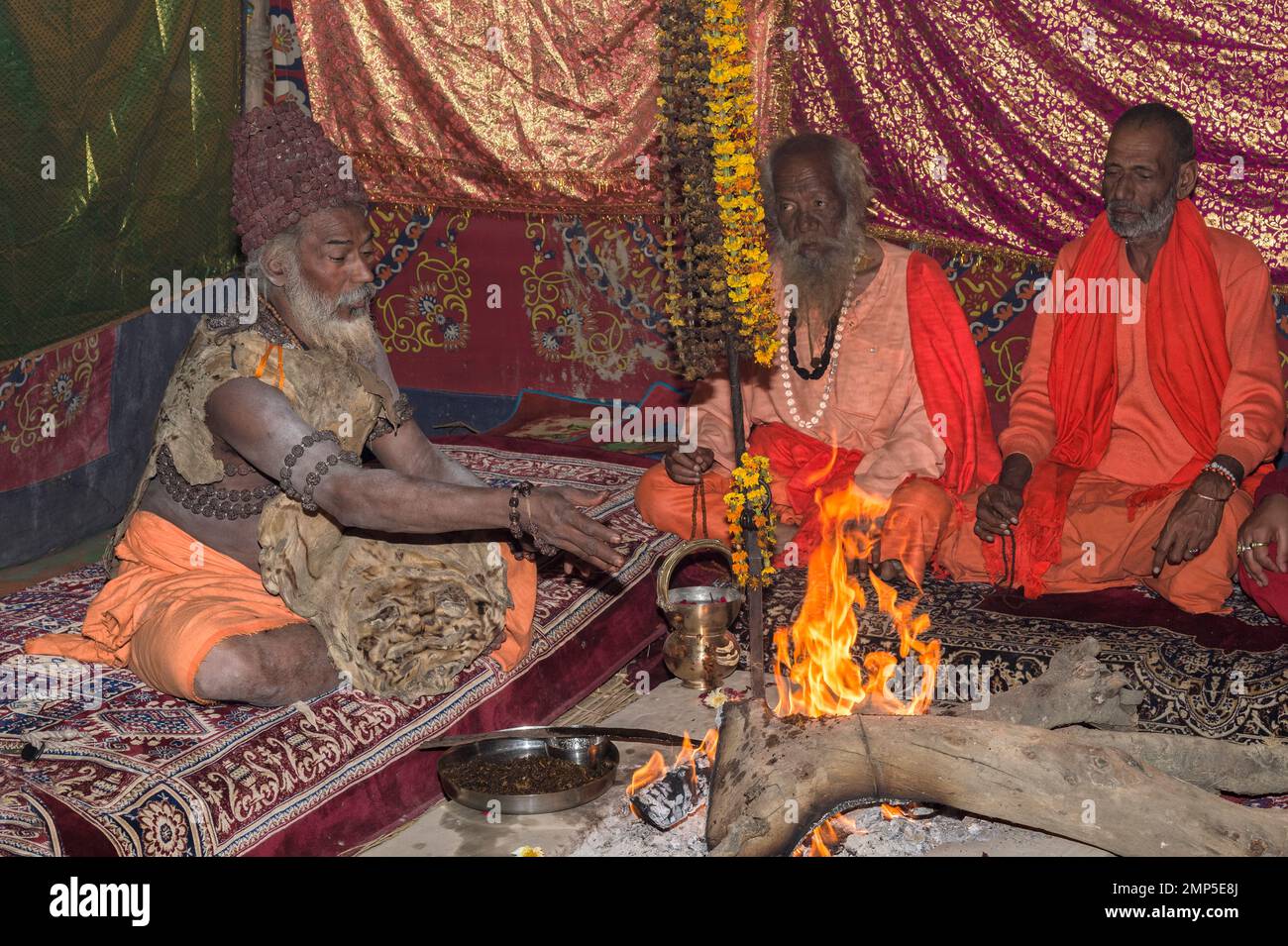 Rome Baba and holy men gathered around fire in his tent, For Editorial ...