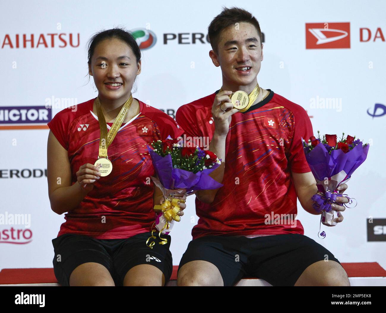 Hong Kong's Tse Ying Suet, left, and Tang Chun Man pose with their gold ...
