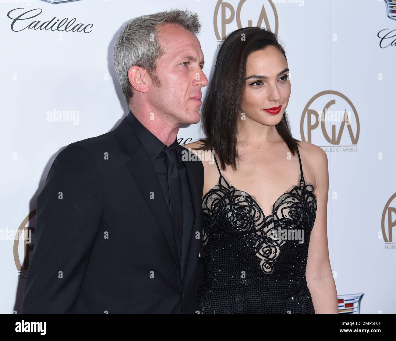Gal Gadot, right, and Yaron Versano arrive at the 29th annual Producers ...