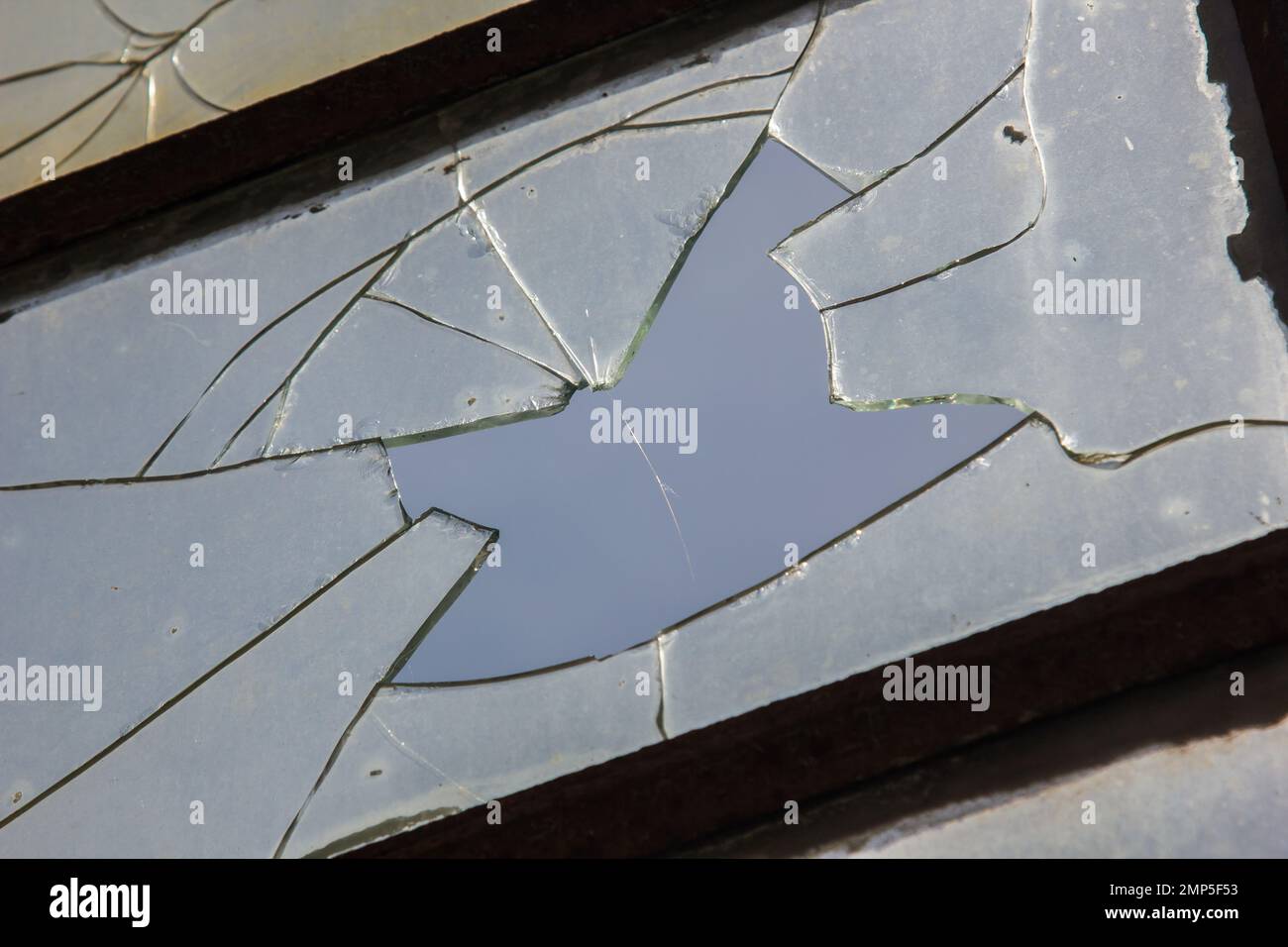 broken glass in the window. background sky, danger, devastation Stock ...