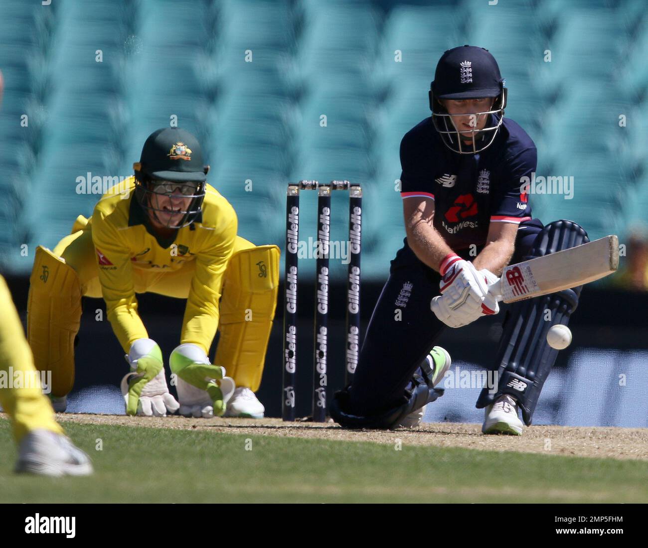 England's Joe Root, right, plays a reverse sweep off Australia's Adam ...
