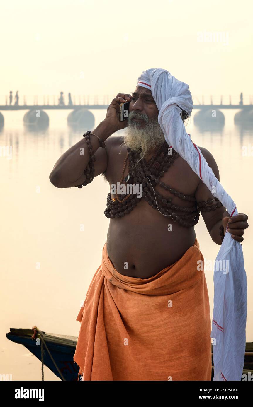 Rome Baba phoning with a cellular on Ganges riverbank, For Editorial ...
