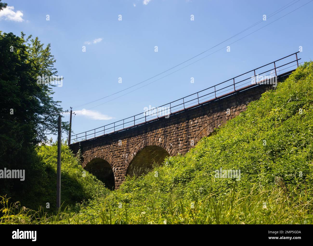 the old railway bridge is built of stone. historic building used Stock ...