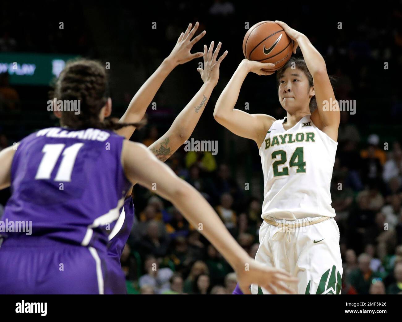 Kansas State's Peyton Williams (11) defends as Baylor's Natalie Chou ...