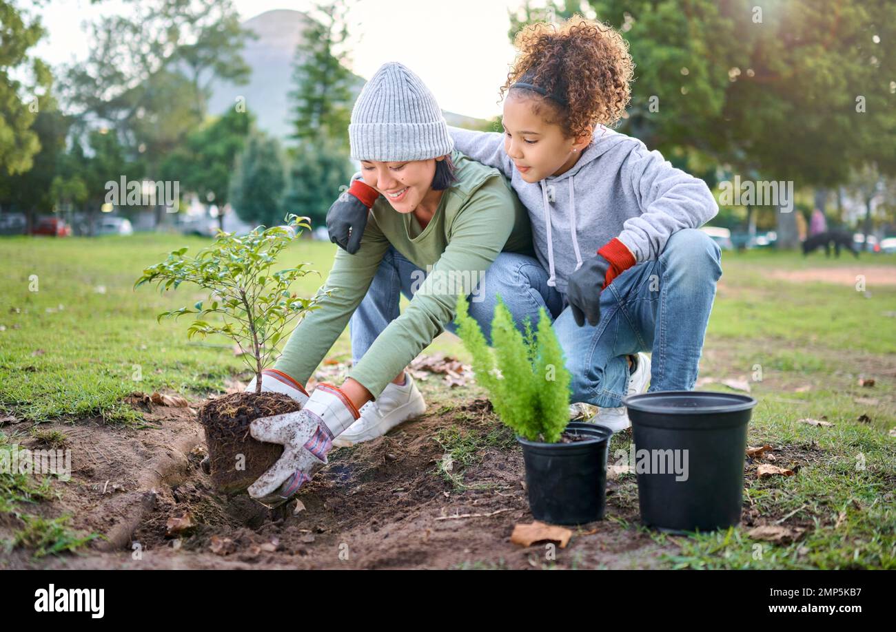 Woman, child and nature park with a plant for gardening trees or ...