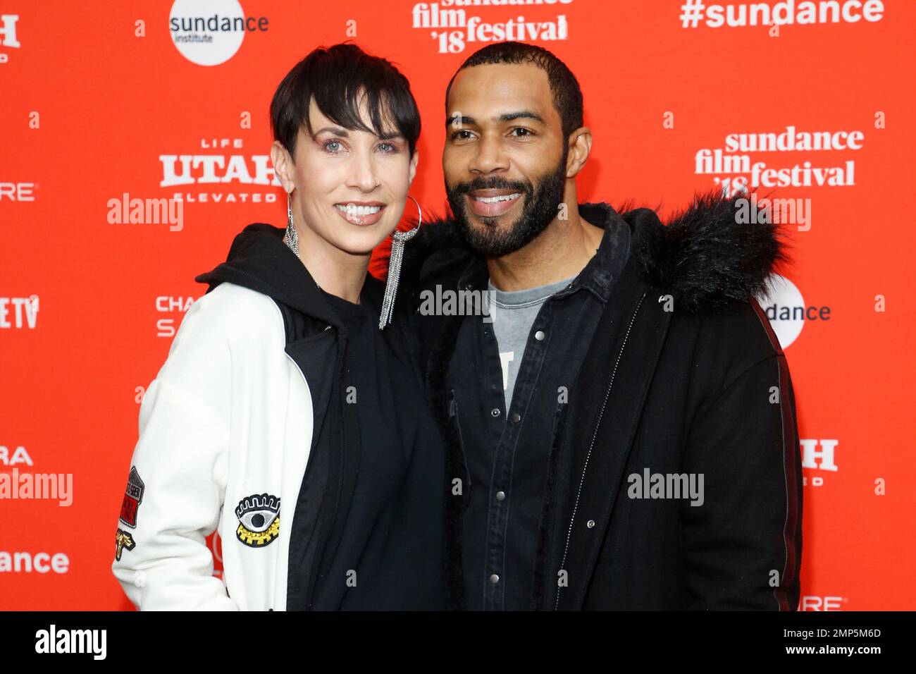 Actor Omari Hardwick, right, and his wife Jennifer Pfautch, left, pose ...