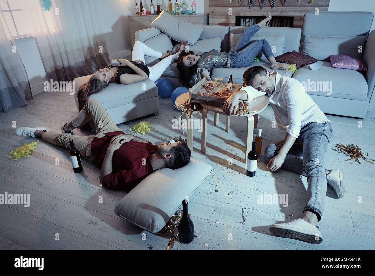 Drunk friends sleeping in messy room after party Stock Photo - Alamy