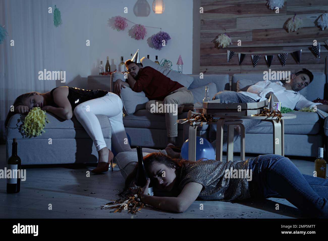 Drunk friends sleeping in messy room after party Stock Photo - Alamy