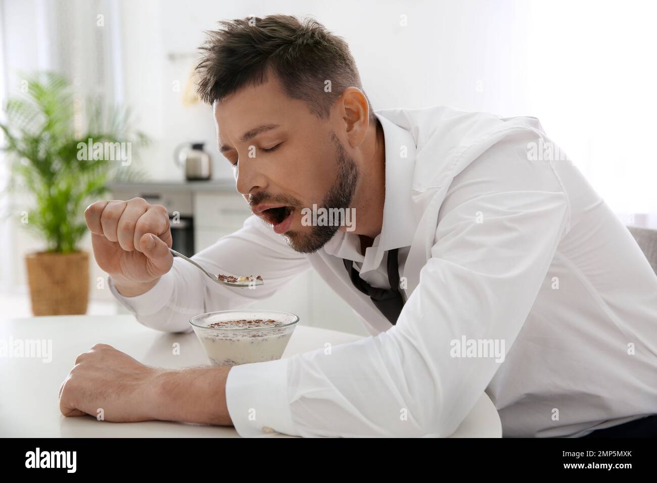 Man tired breakfast hi-res stock photography and images - Alamy