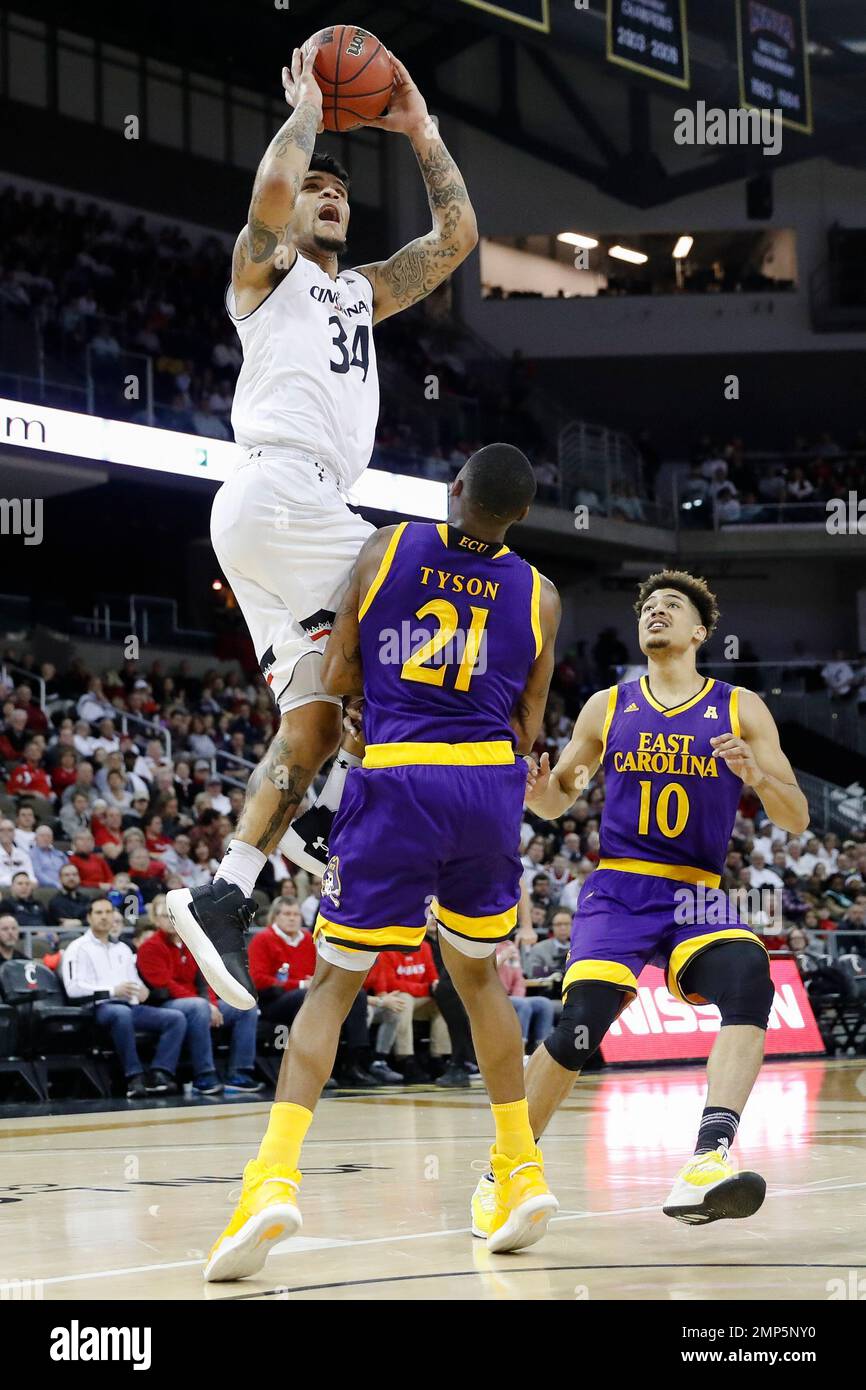 Cincinnati's Jarron Cumberland (34) shoots over ECU's B.J. Tyson (21 ...