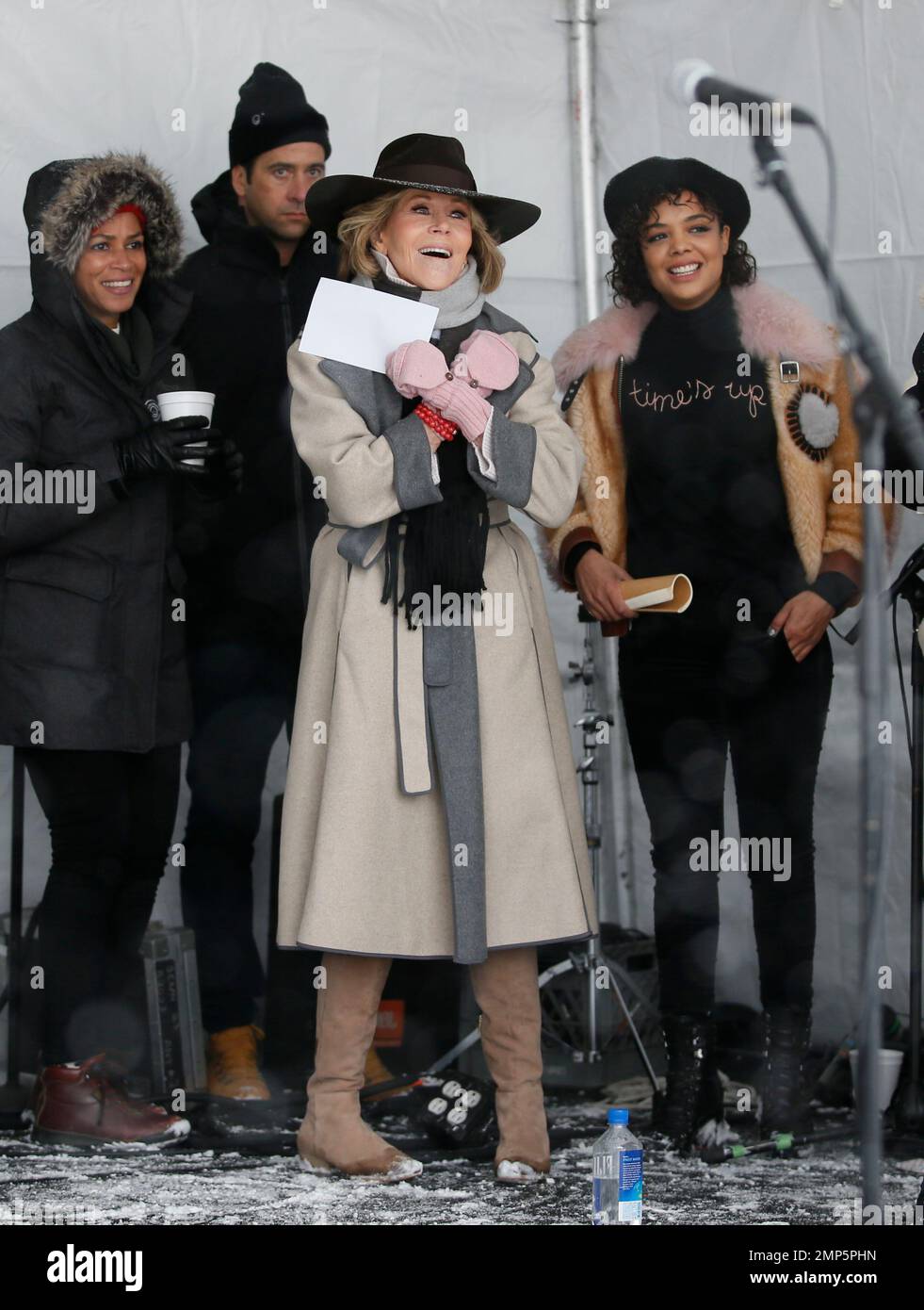 Actress Jane Fonda, left, gestures a hug to someone in the crowd as she ...
