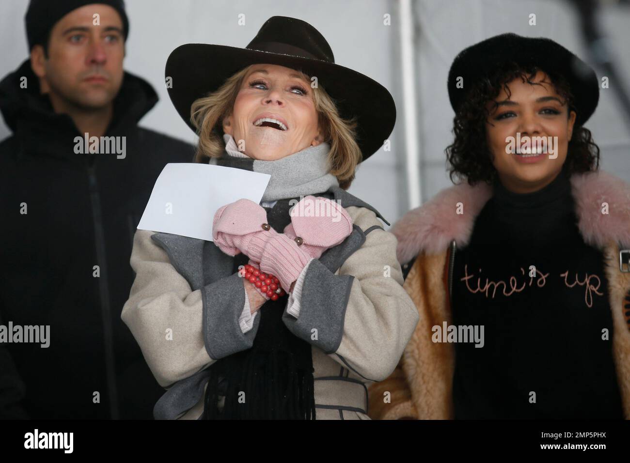 Actress Jane Fonda, left, gestures a hug to someone in the crowd as she ...