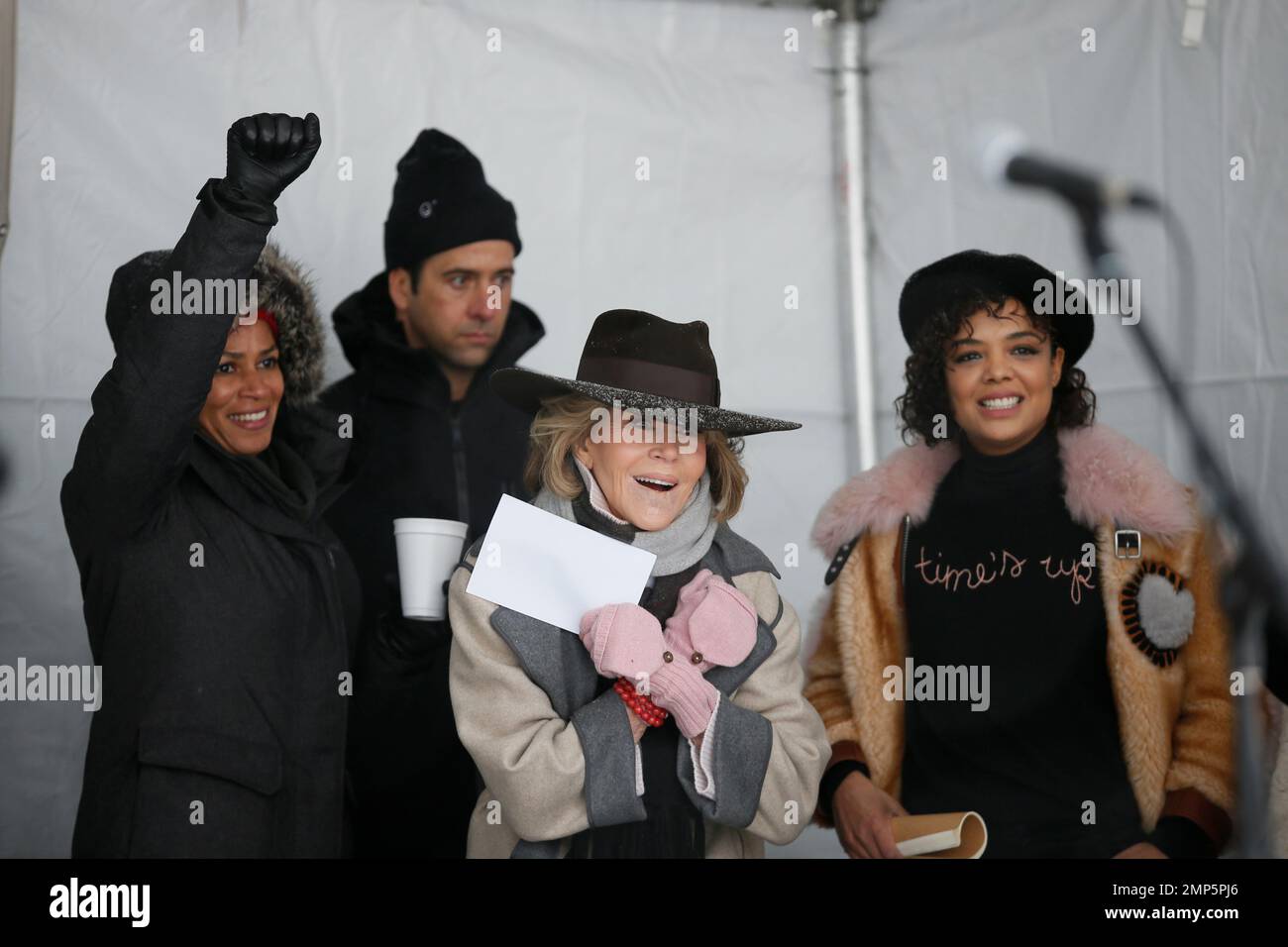 Actress Jane Fonda, left, gestures a hug to someone in the crowd as she ...