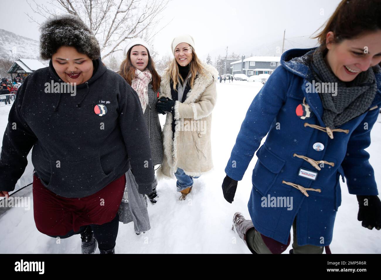 Actress Maria Bello, center, reacts with local actresses Tenisha Nicole ...