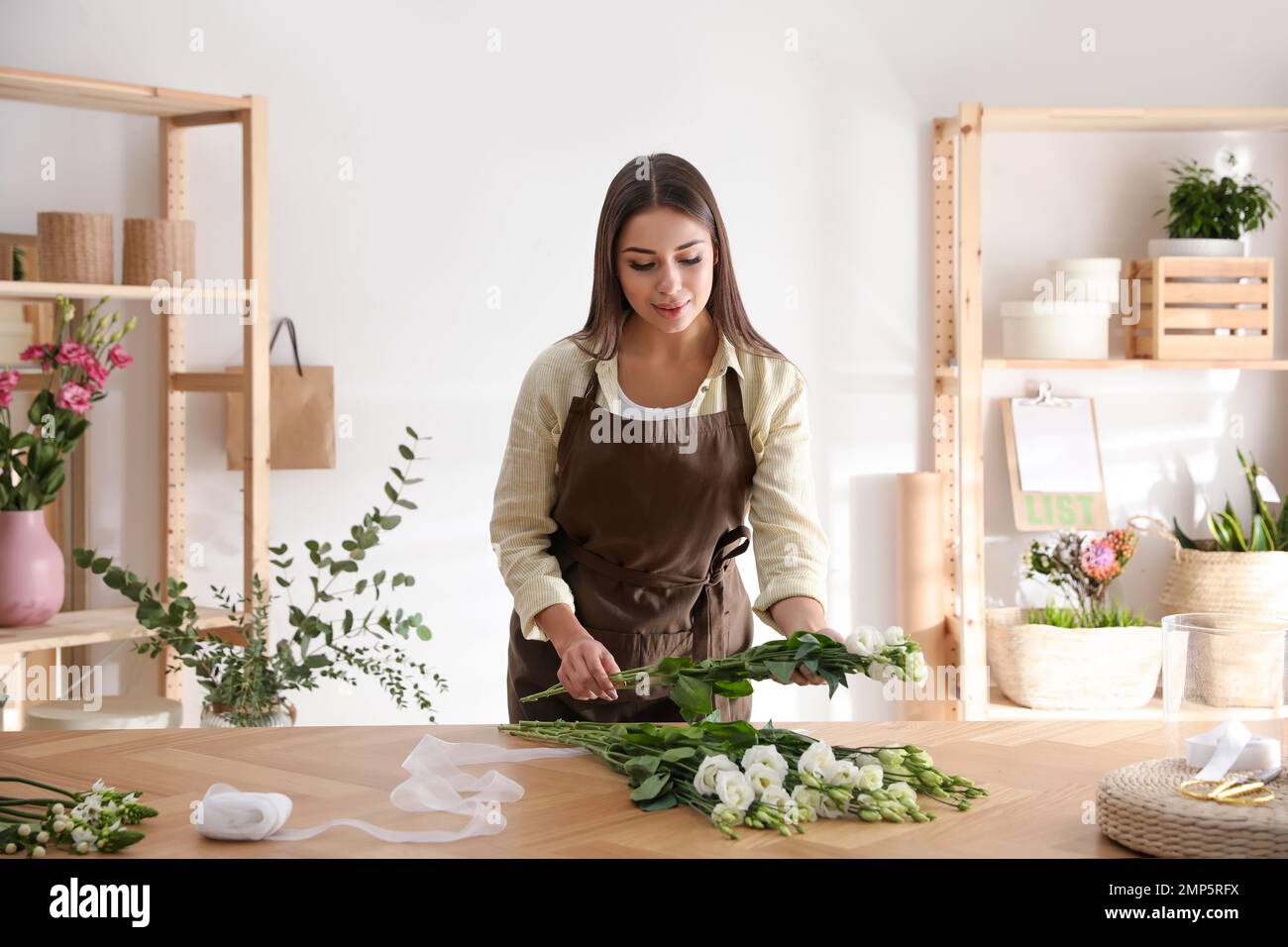 Female caucasian florist making bouquet hi-res stock photography and ...