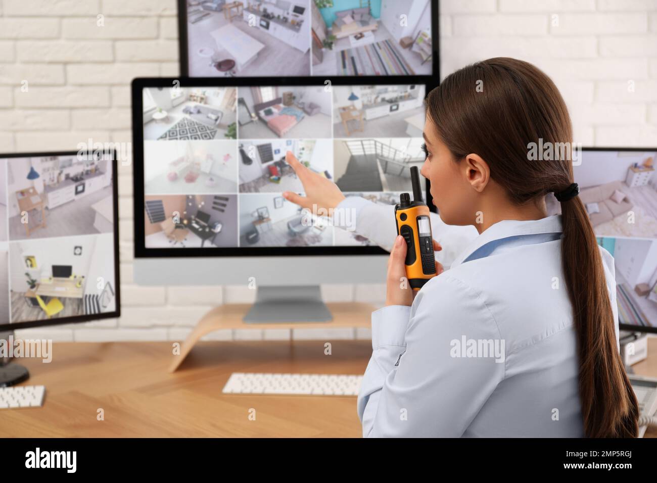 Female security guard with portable transmitter at workplace Stock ...