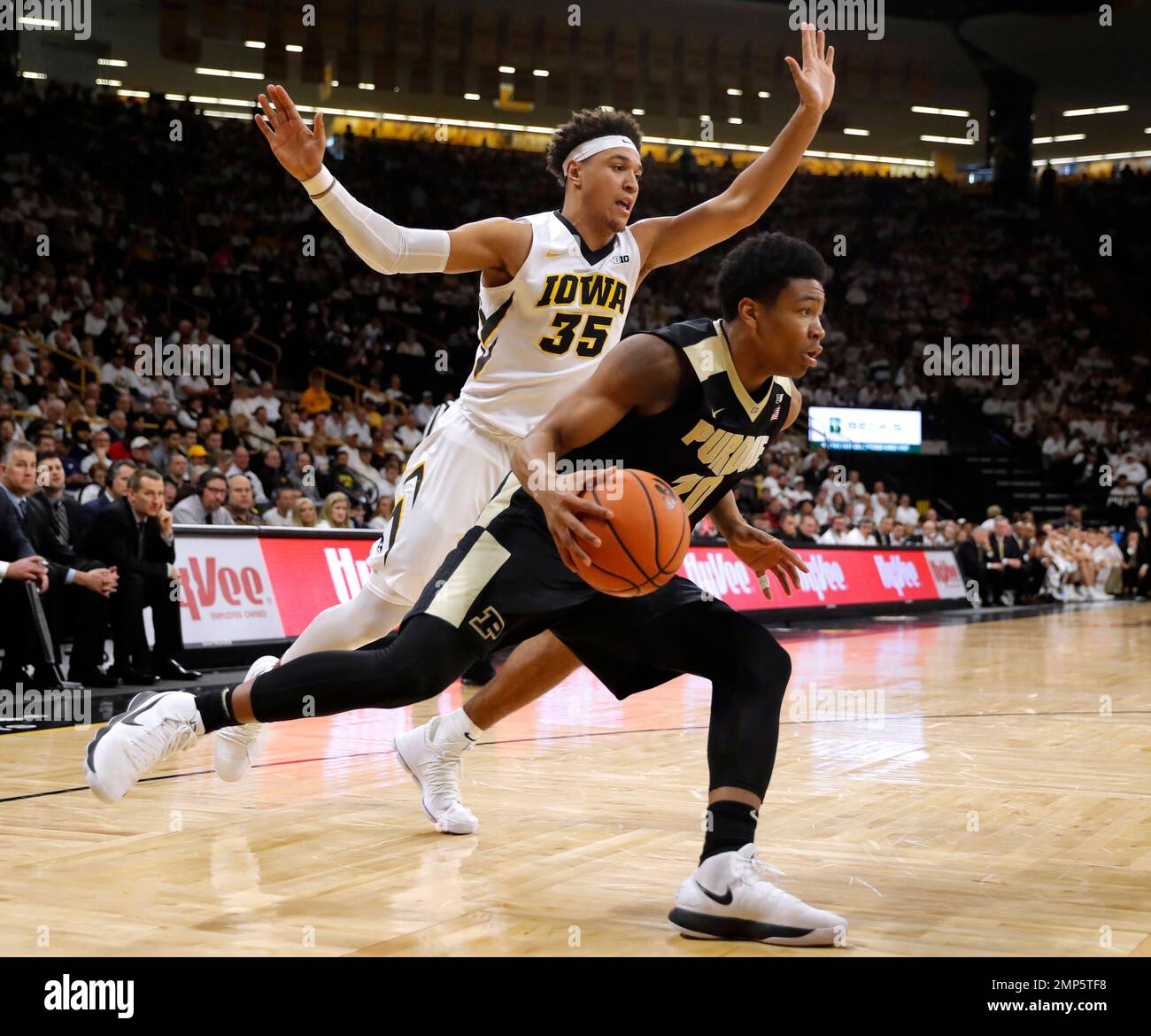 Purdue guard Nojel Eastern drives past Iowa forward Cordell Pemsl (35 ...
