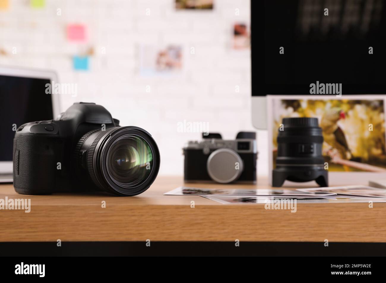Photographer's workplace with professional camera in office Stock Photo ...
