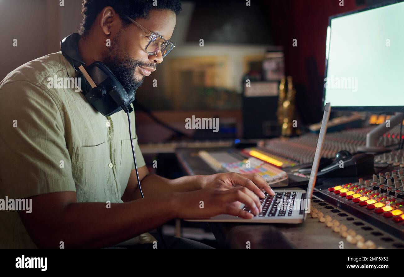 Black man, thinking and laptop for music recording, sound engineering ...