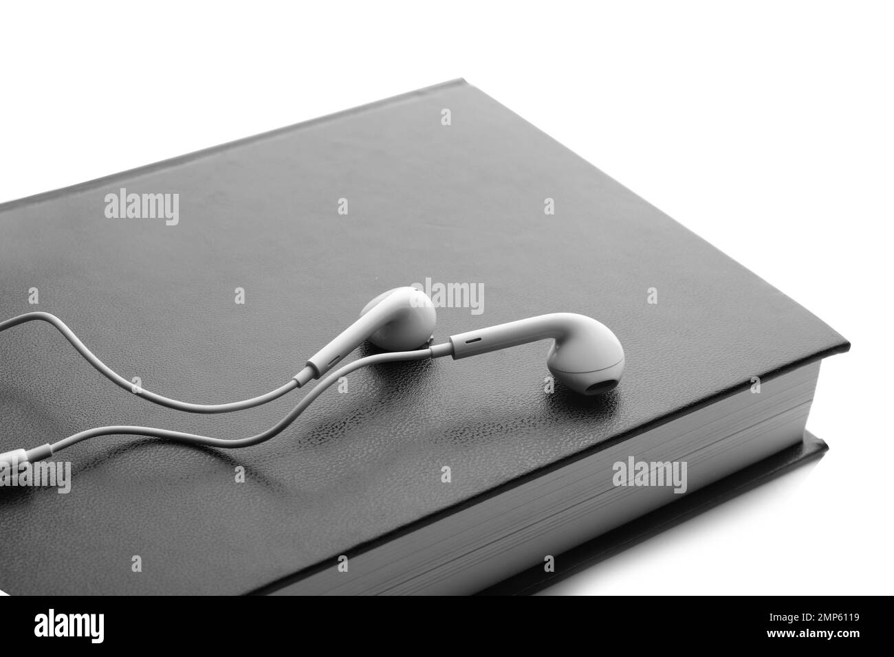 Bible and earphones on white background, closeup. Religious audiobook ...