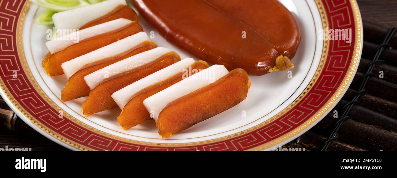 Delicious fresh mullet roe with white radish slices and garlic sprout ...