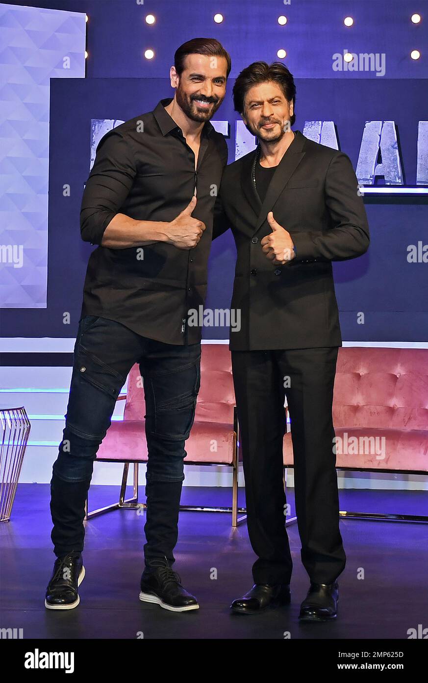 L-R Bollywood actors John Abraham and Shahrukh Khan pose for a photo at ...