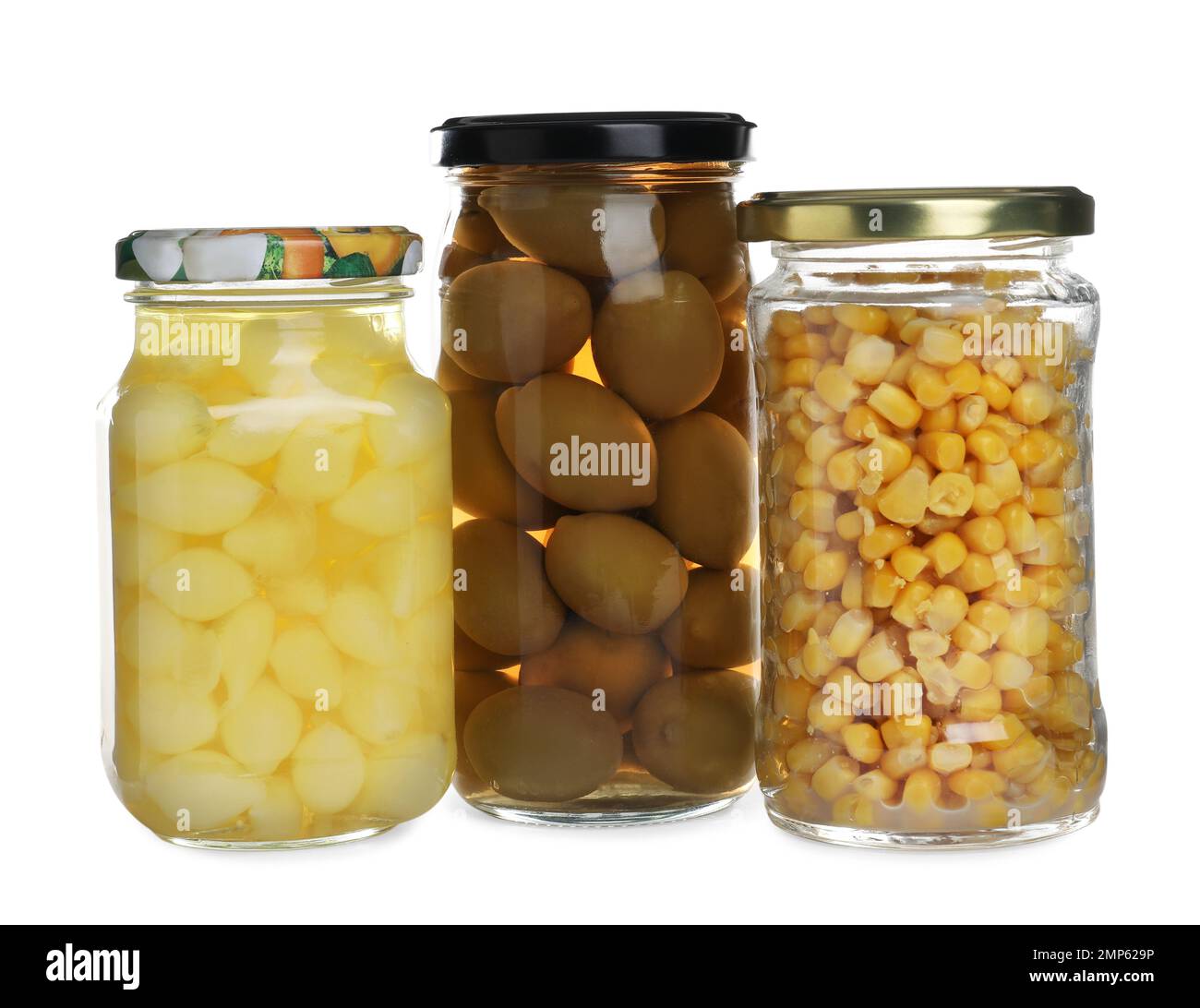 Glass jars of different pickled vegetables isolated on white Stock ...